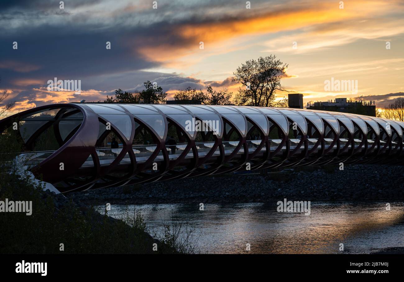 A pedestrian bridge during sunset at a popular tourist destination near ...