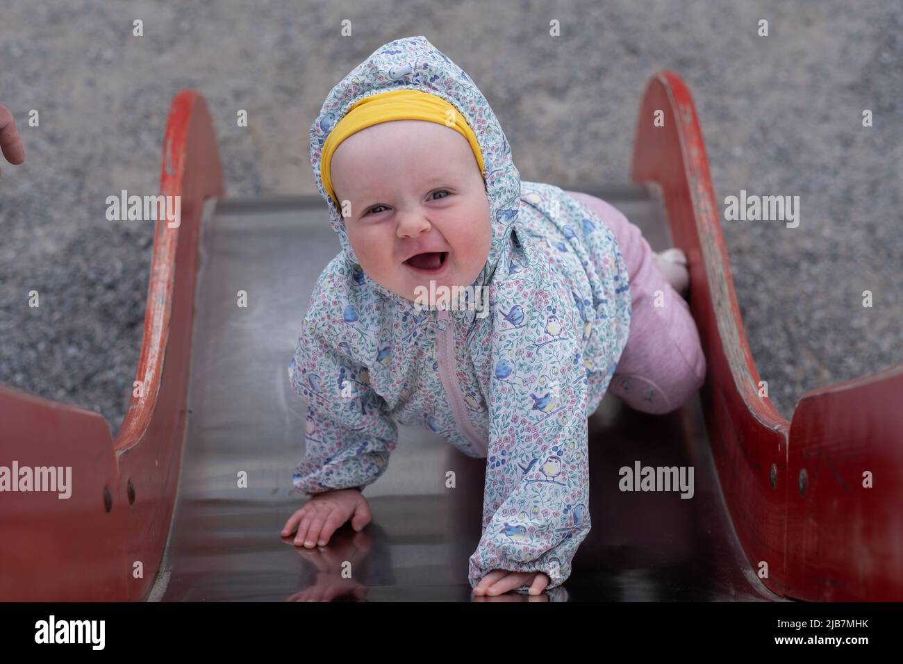 Child climbing up slide hi-res stock photography and images - Alamy