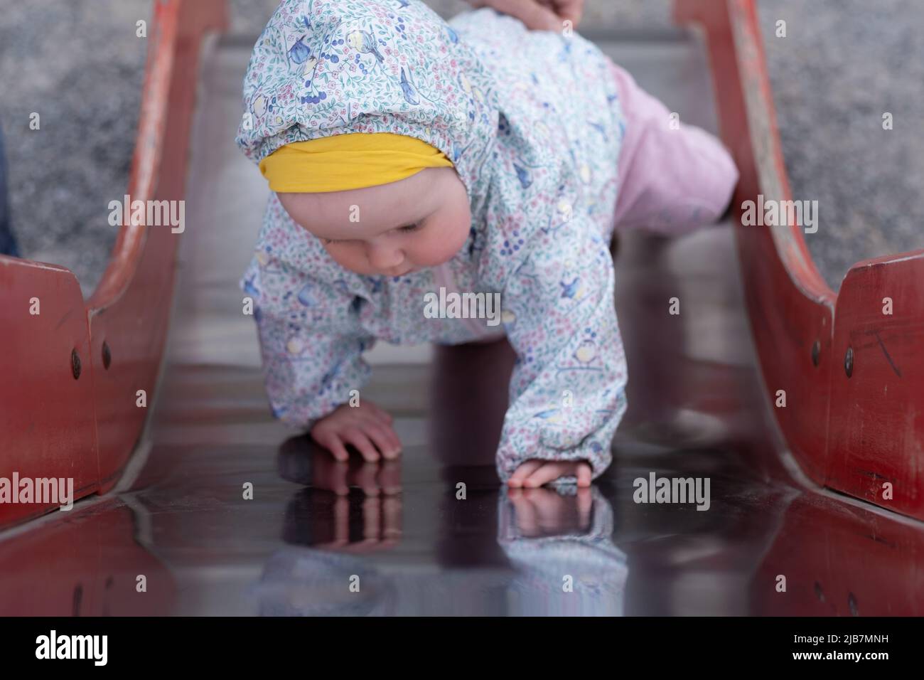 Baby climbing small slide hi-res stock photography and images - Alamy