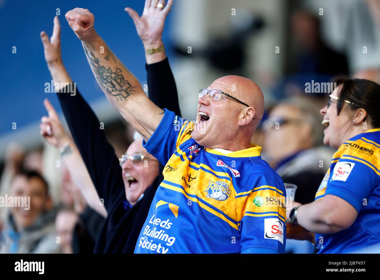 Leeds Rhinos fans celebrate their side's fourth try of the game, scored ...