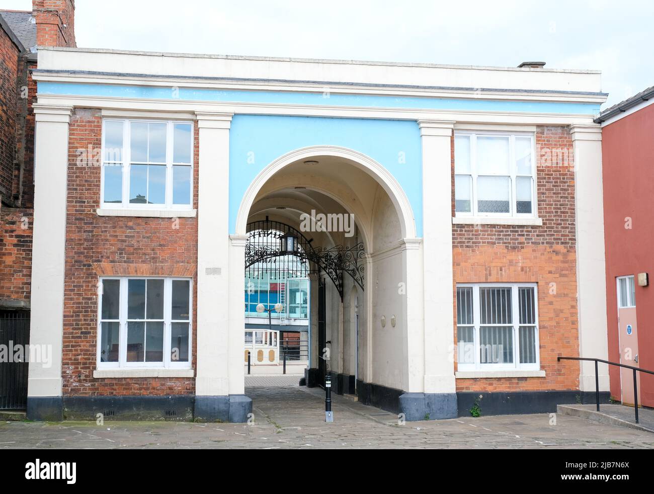 An elegant arched entrance to a cobbled courtyard by the marina in Hull ...