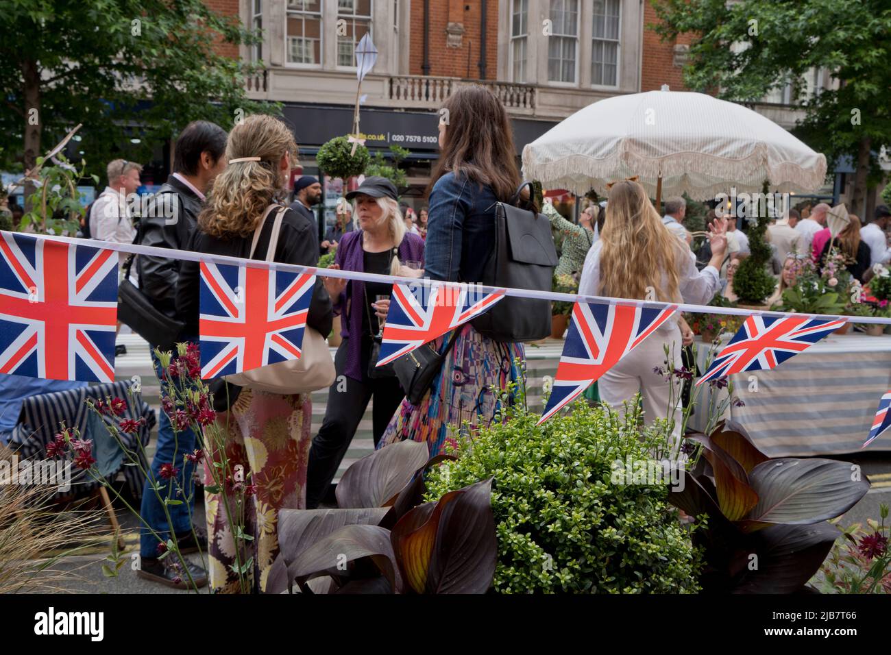 Visitors at a street party to commemorate Queen Elizabeth II 70th year ...