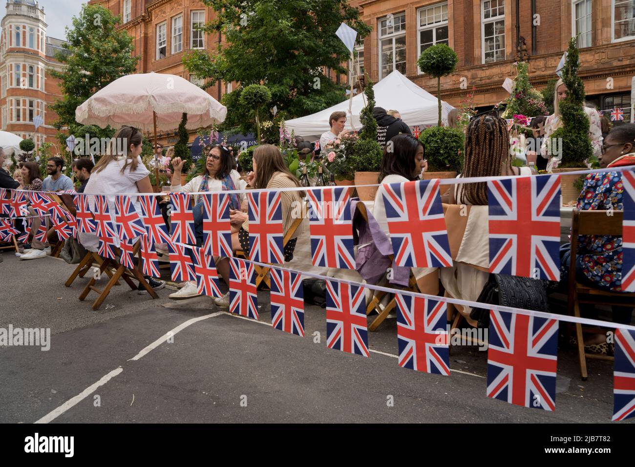 Visitors at a street party to commemorate Queen Elizabeth II 70th year ...