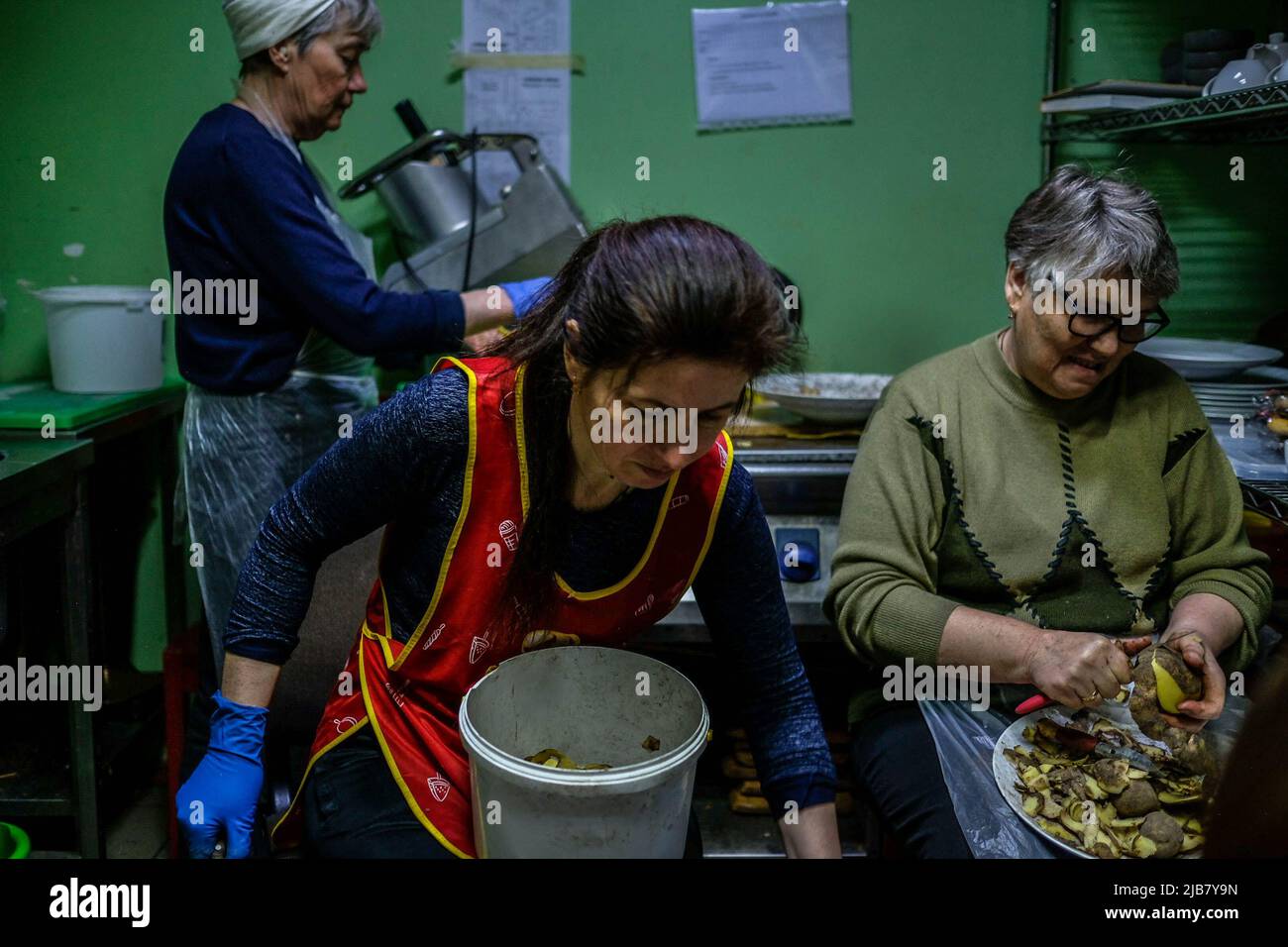 Volunteers Seen Peeling Potatoes In A Restaurant Closed To Public Where