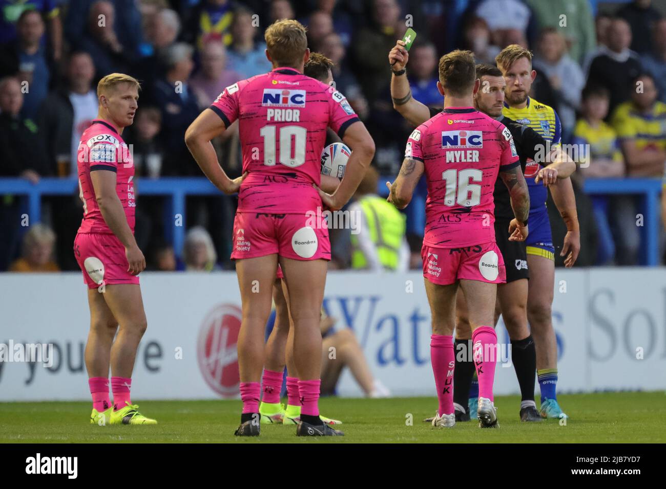 Referee Jack Smith issues a green card to James Donaldson #25 of Leeds ...
