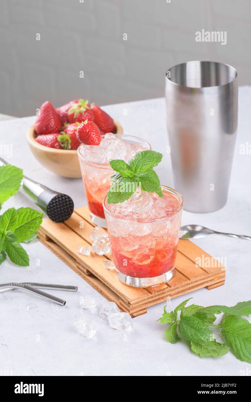 Cold strawberry cocktail mojito, margarita, daiquiri in two glasses ...
