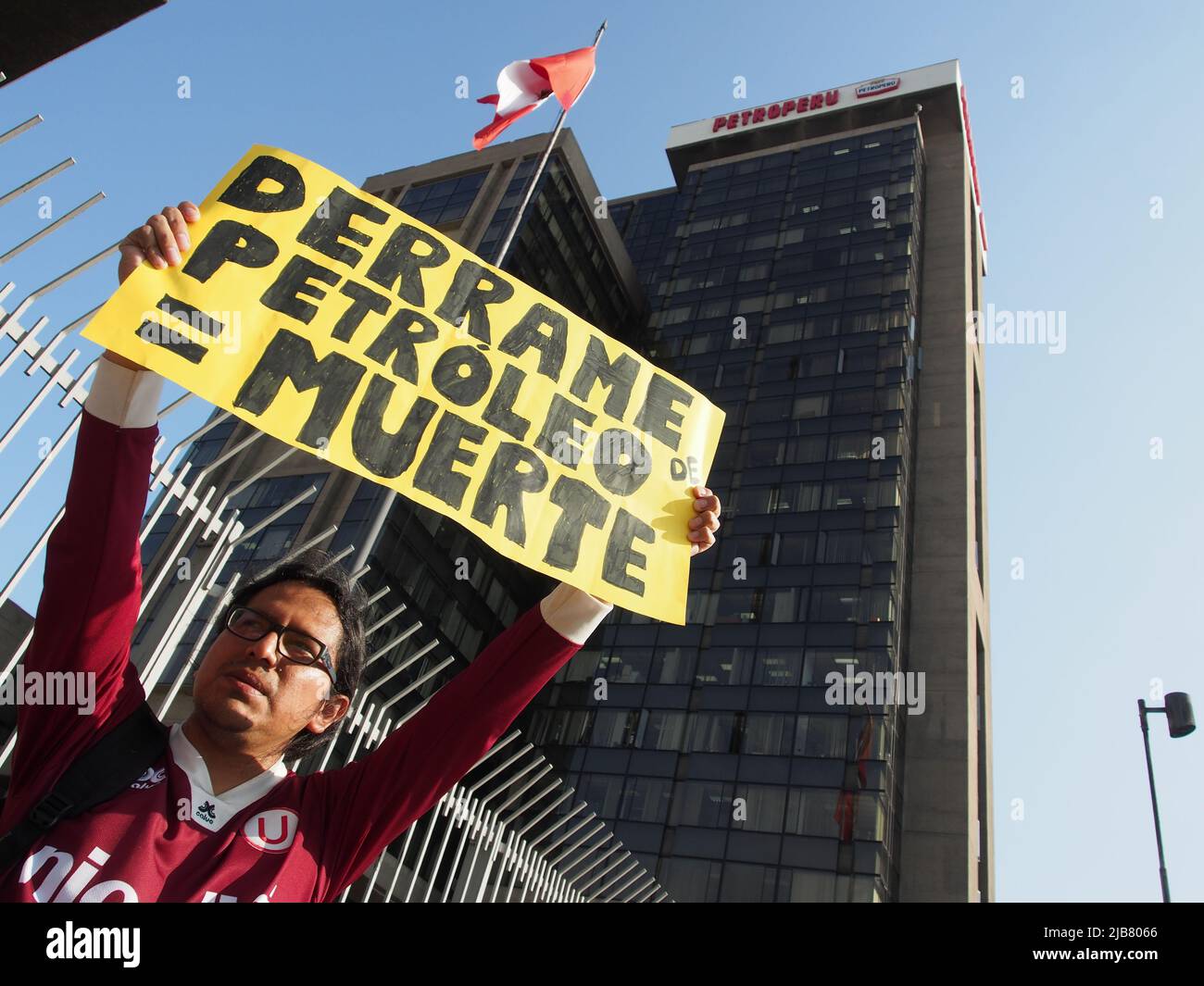 "Oil spill = death" can be read. Activists take to the streets in ...