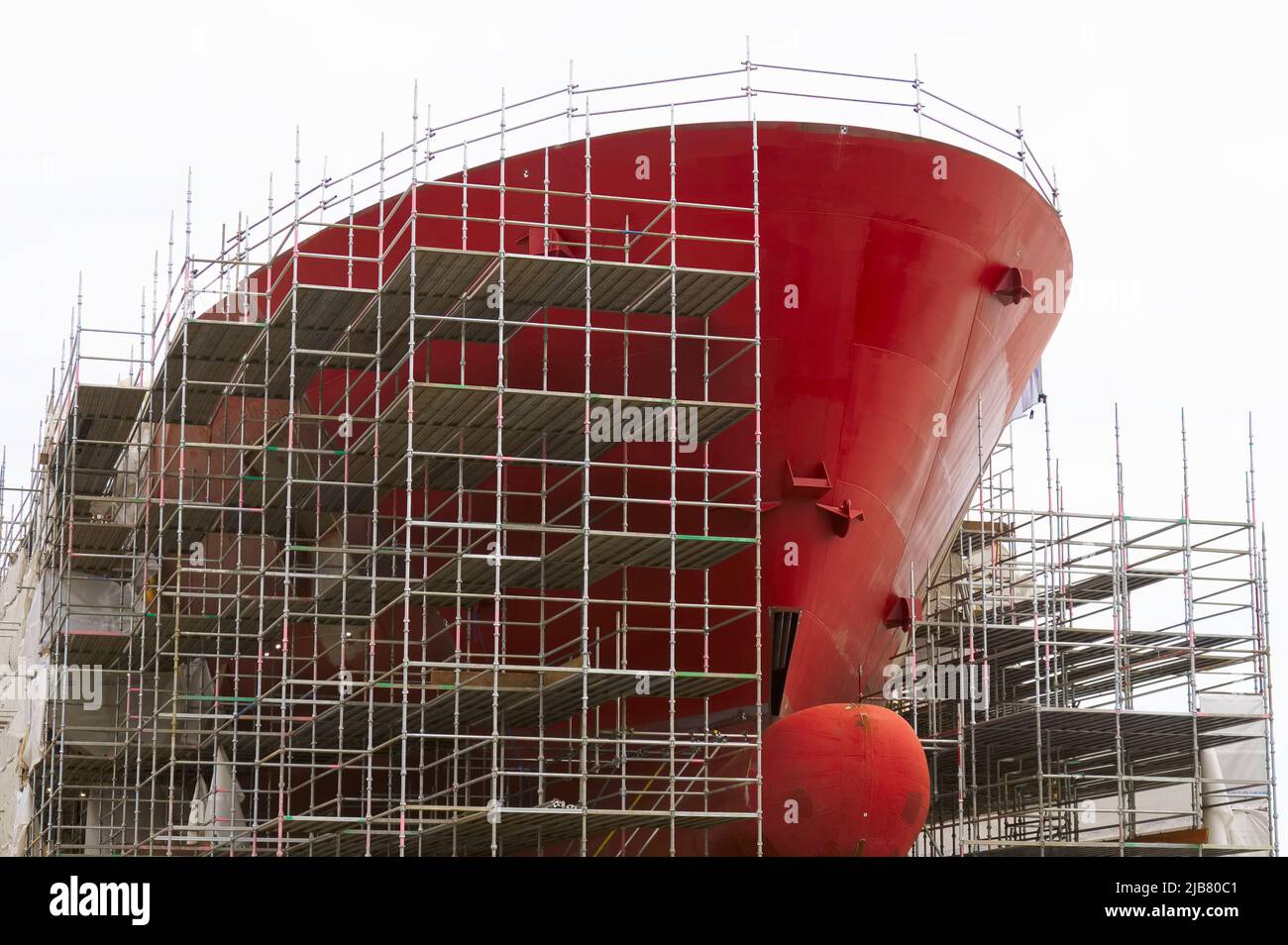 Shipbuilding and crane during ferry construction surrounded by scaffold ...