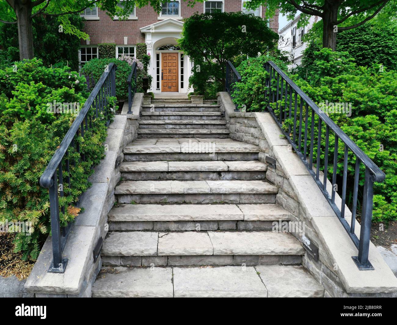 Long stone staircase going to house at the top of a hill Stock Photo ...