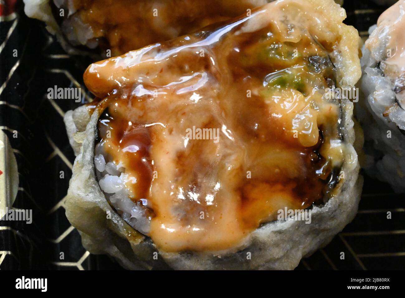 The delicious Godzilla sushi roll Stock Photo - Alamy