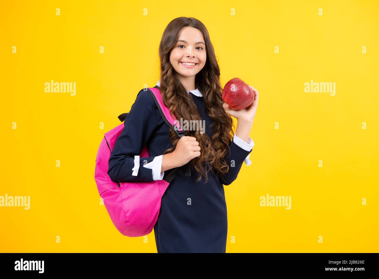 Back to school. Teenager school girl with backpack hold aplle ready to ...