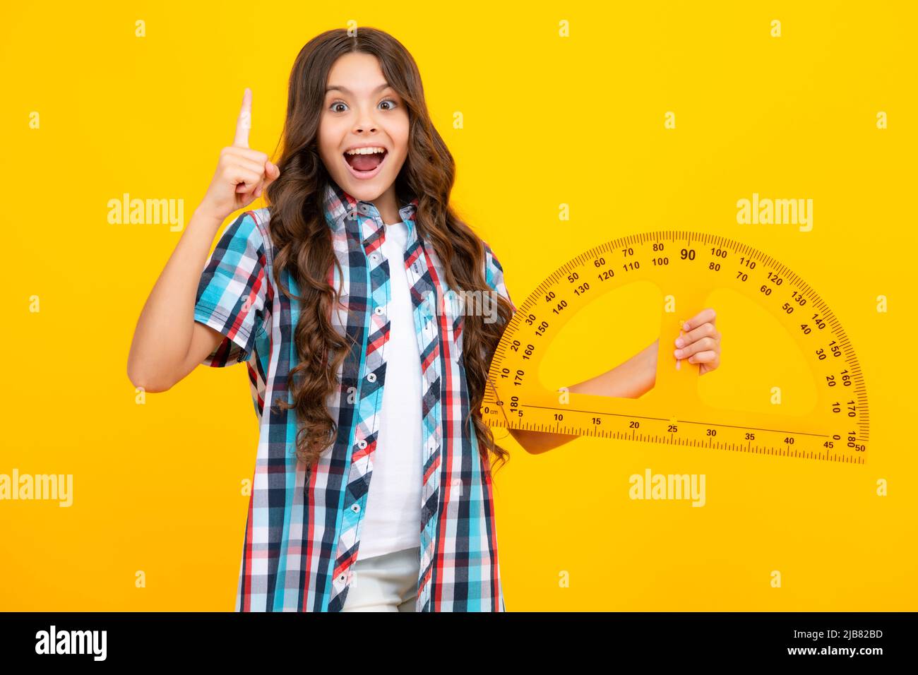 Amazed teen girl. Back to school. School girl hold ruler measuring ...