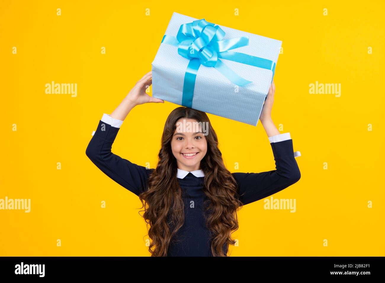 Teenager kid with present box. Teen child girl giving birthday gift ...