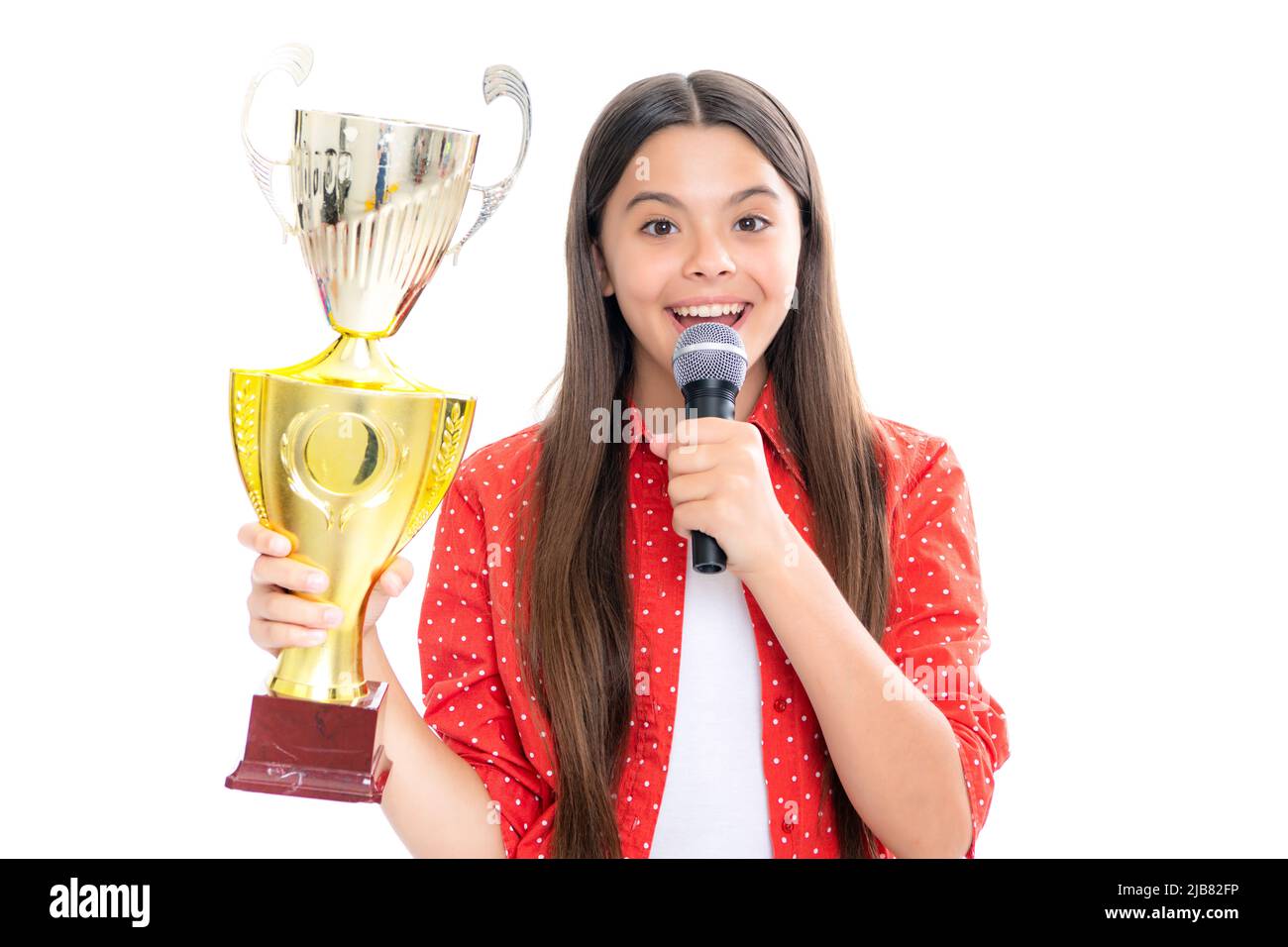 Girl with win cup microphone speech. Teen holding a trophy. Kid winner ...
