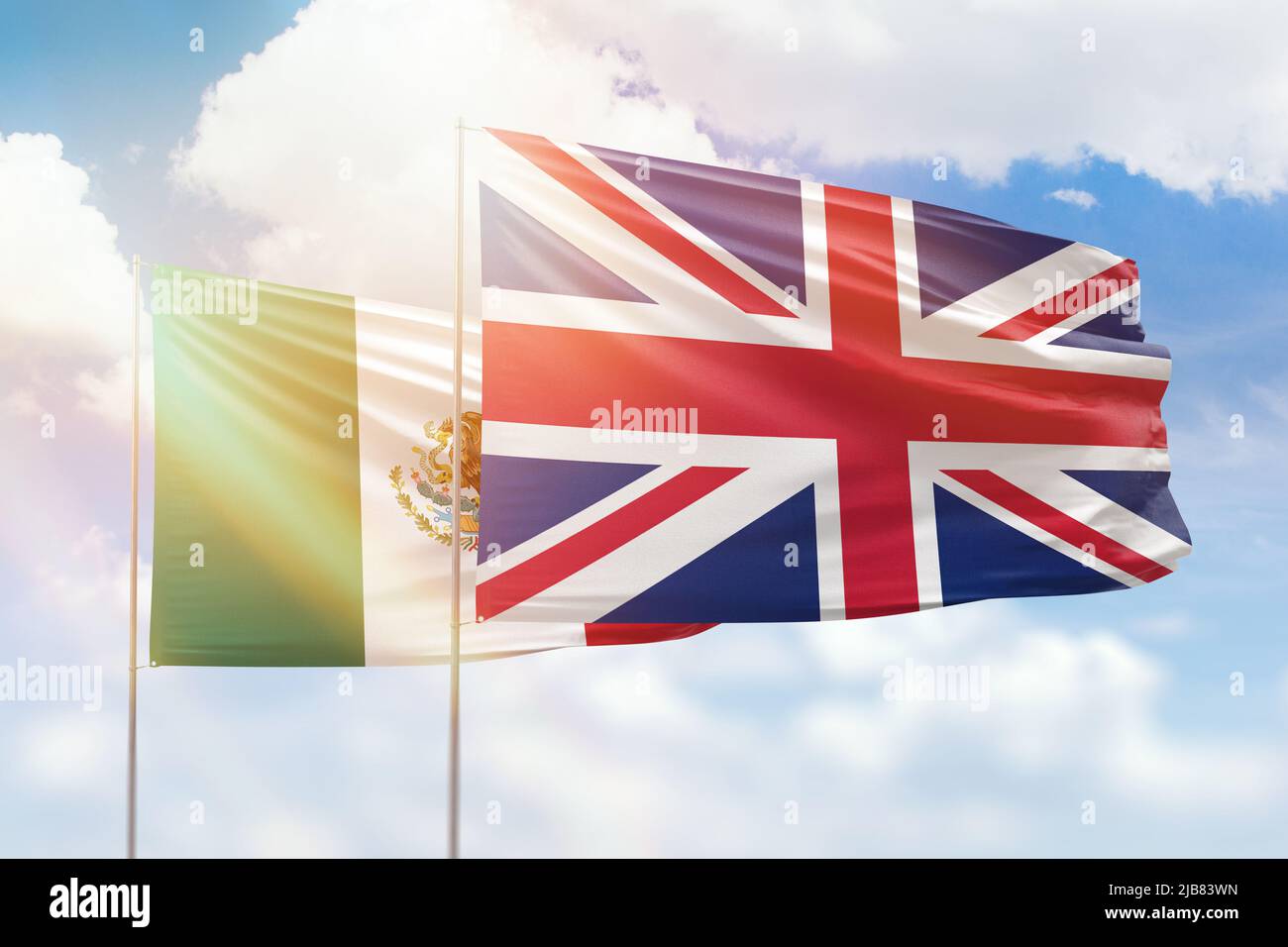 Sunny blue sky and flags of united kingdom and mexico Stock Photo - Alamy