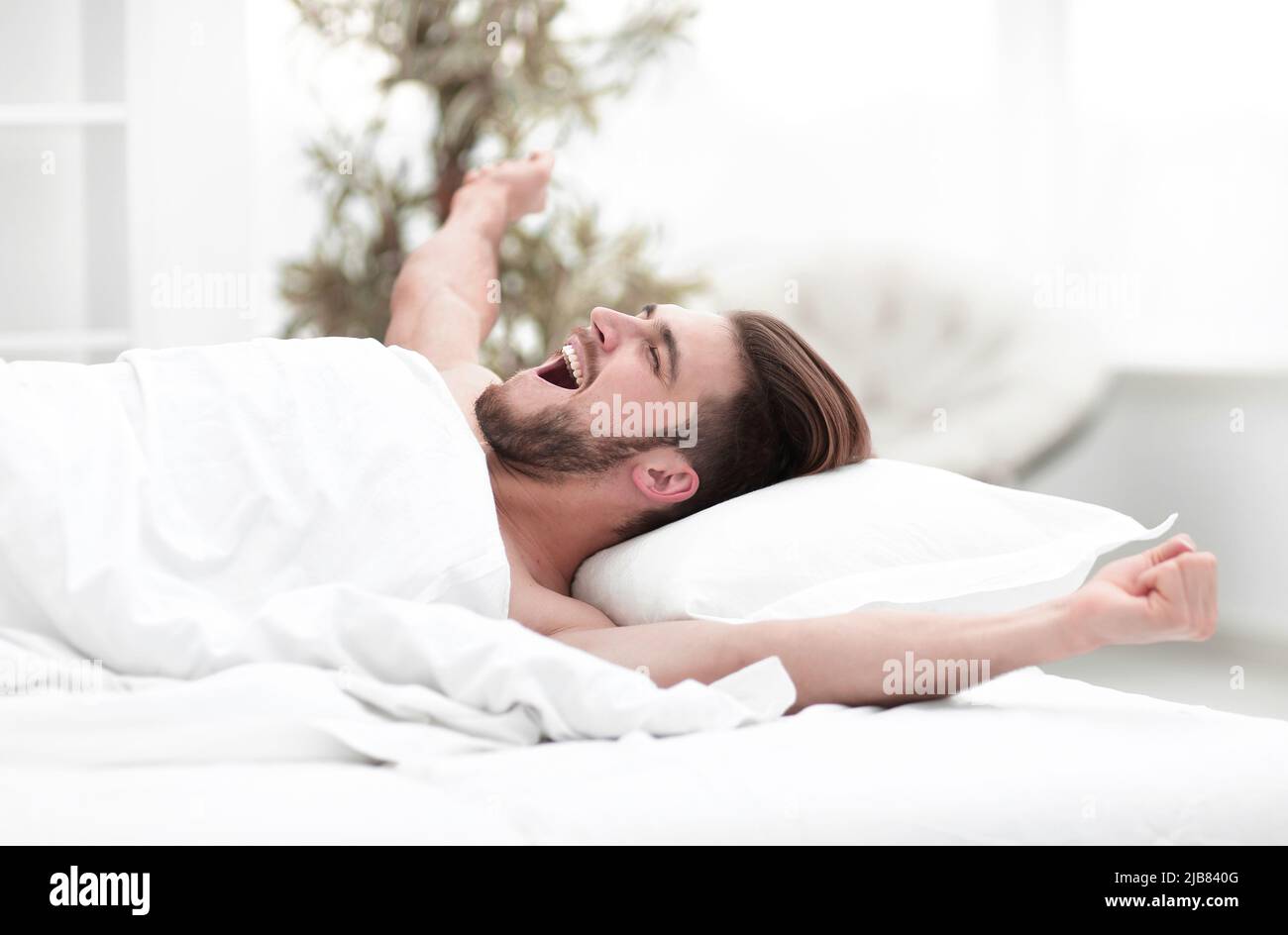 business man falling asleep in the comfortable hotel room Stock Photo ...