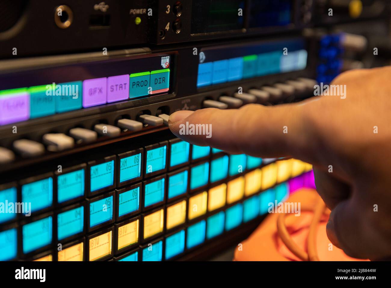 Person using an intercom panel to communicate during a live broadcast ...