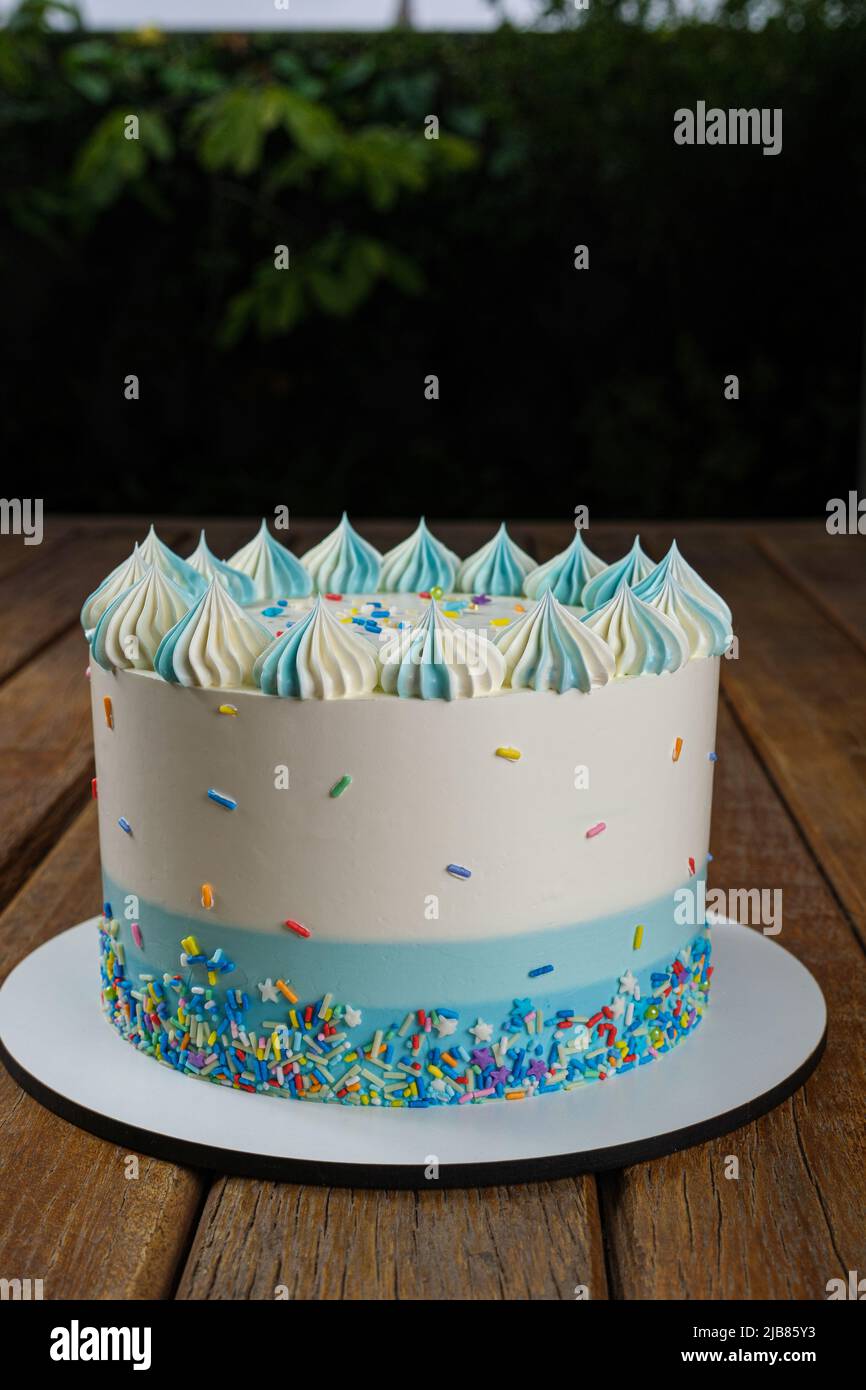 Vanilla cake with buttercream frosting, decorated with colorful ...