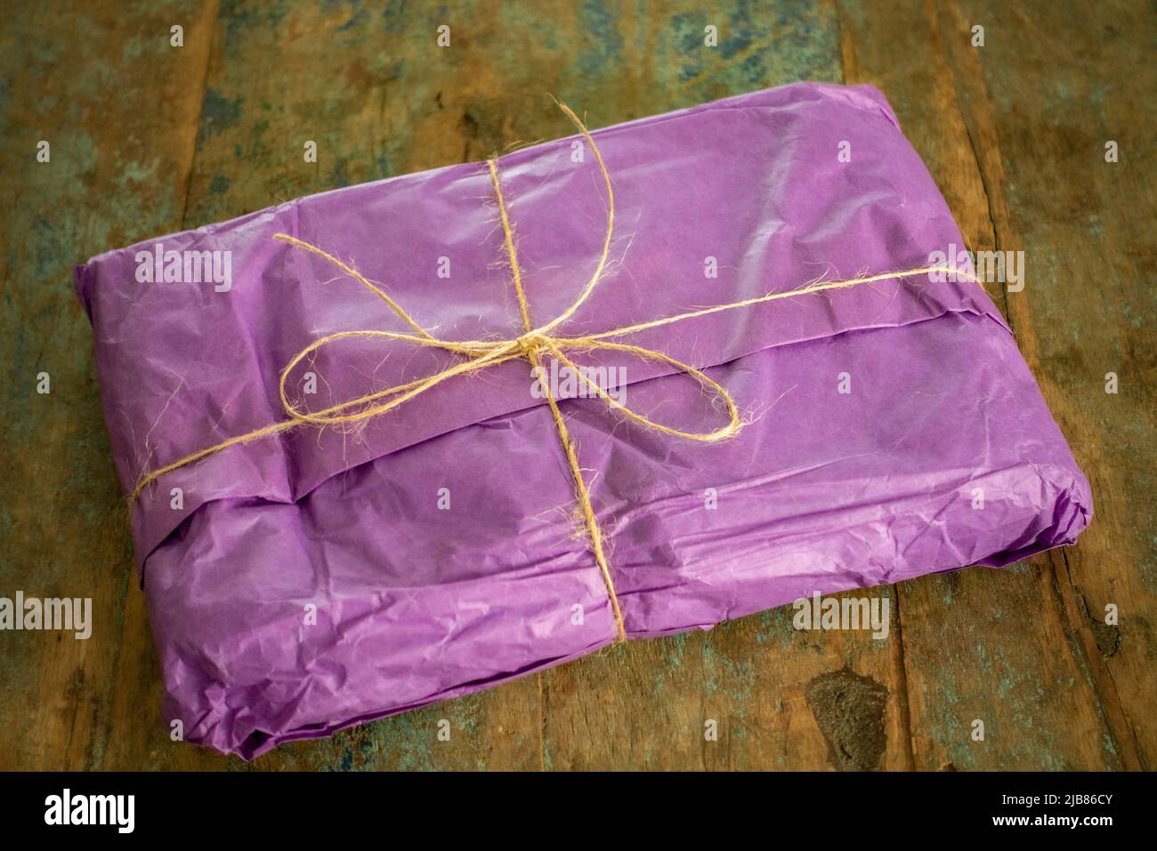 Tissue paper wrapped present hi-res stock photography and images - Alamy