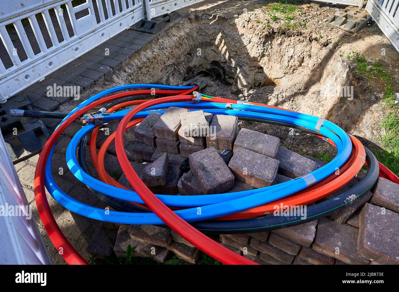 fiber laying for high speed internet construction site Stock Photo - Alamy