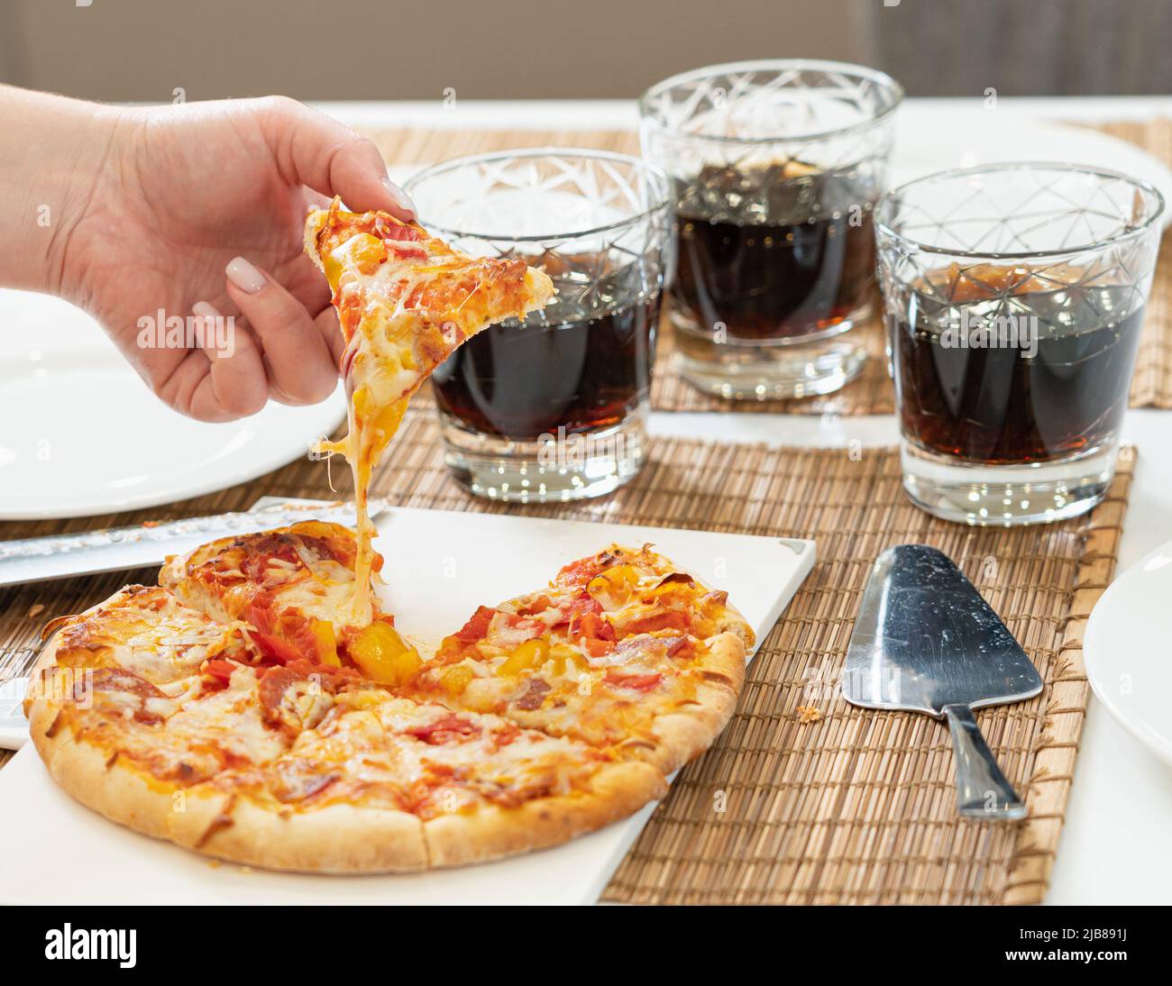dinner for three close-up homemade pizza and coke Stock Photo - Alamy