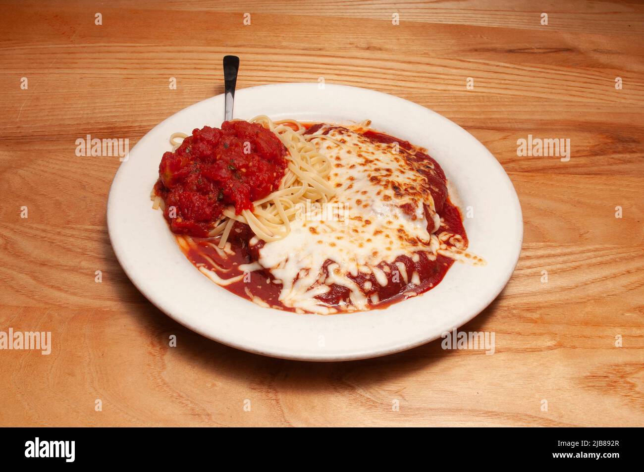 Authentic Italian cuisine known as chicken parmesan Stock Photo - Alamy