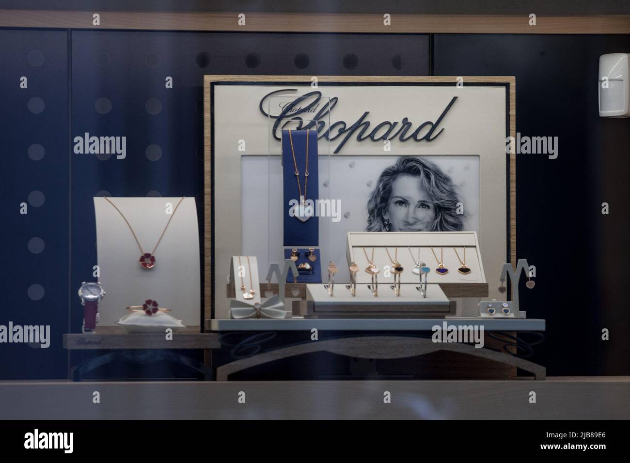 Picture of a sign with the logo of Chopard taken above somes watches of ...