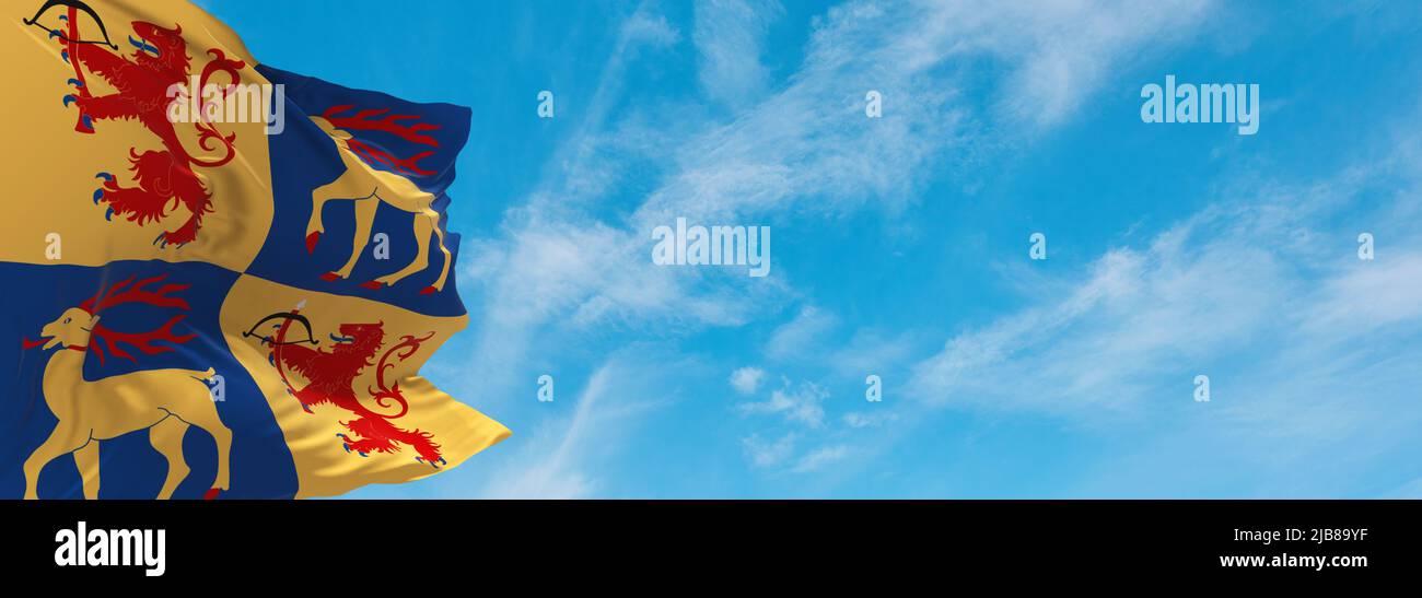 official flag of Kalmar , Sweden at cloudy sky background on sunset ...