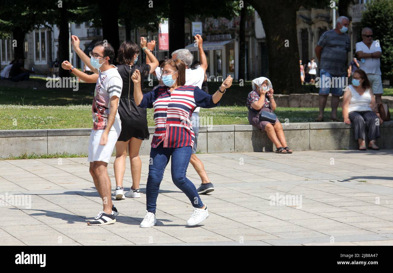 People dancing in the street, traditional folk dance of the region ...