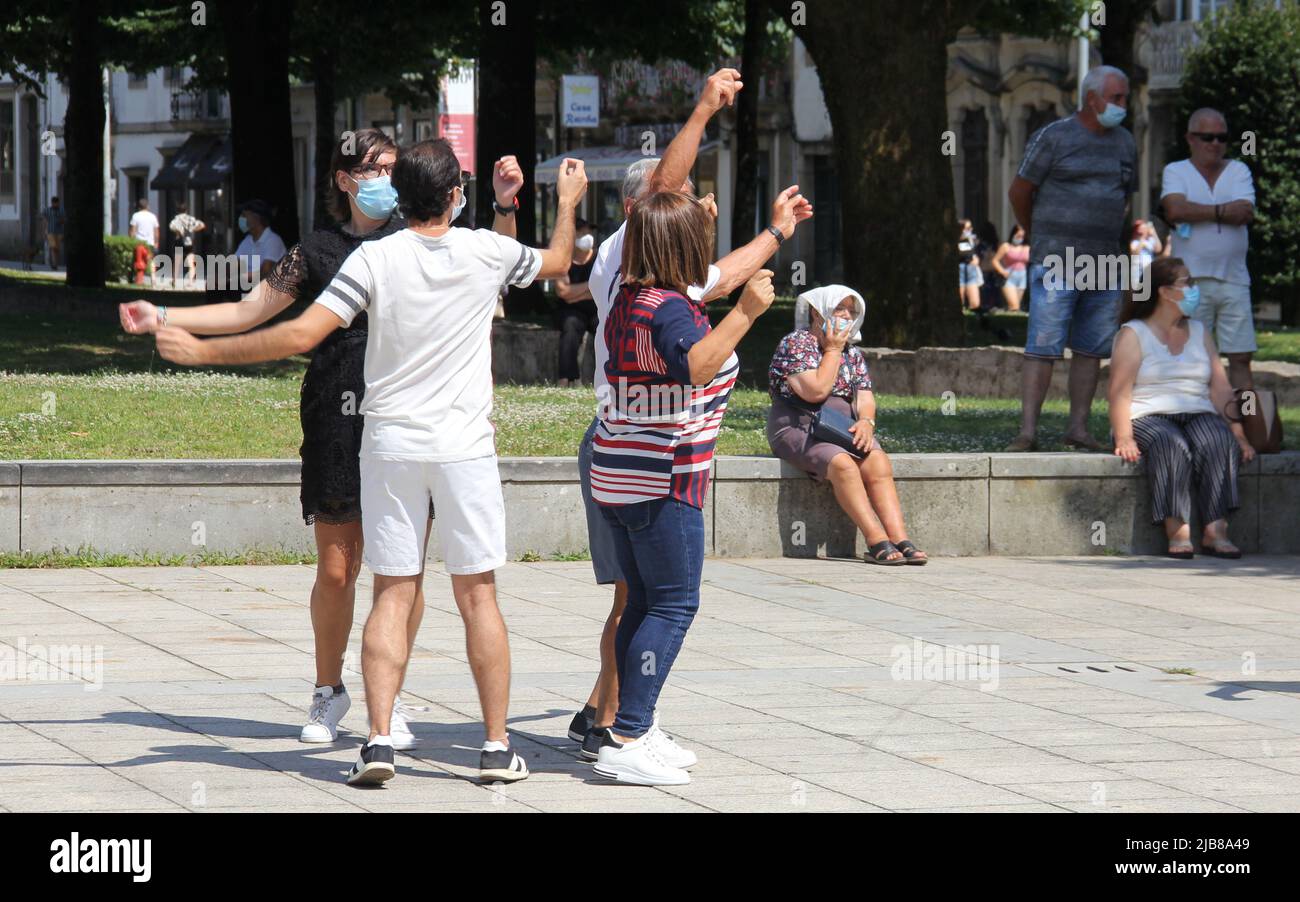 People dancing in the street, traditional folk dance of the region ...
