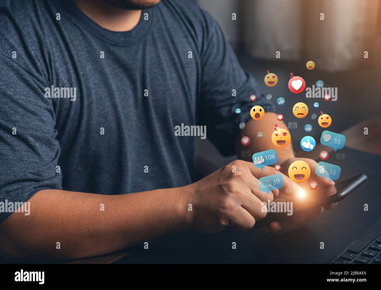 Hands holding and typing to communicate with others through emoji ...