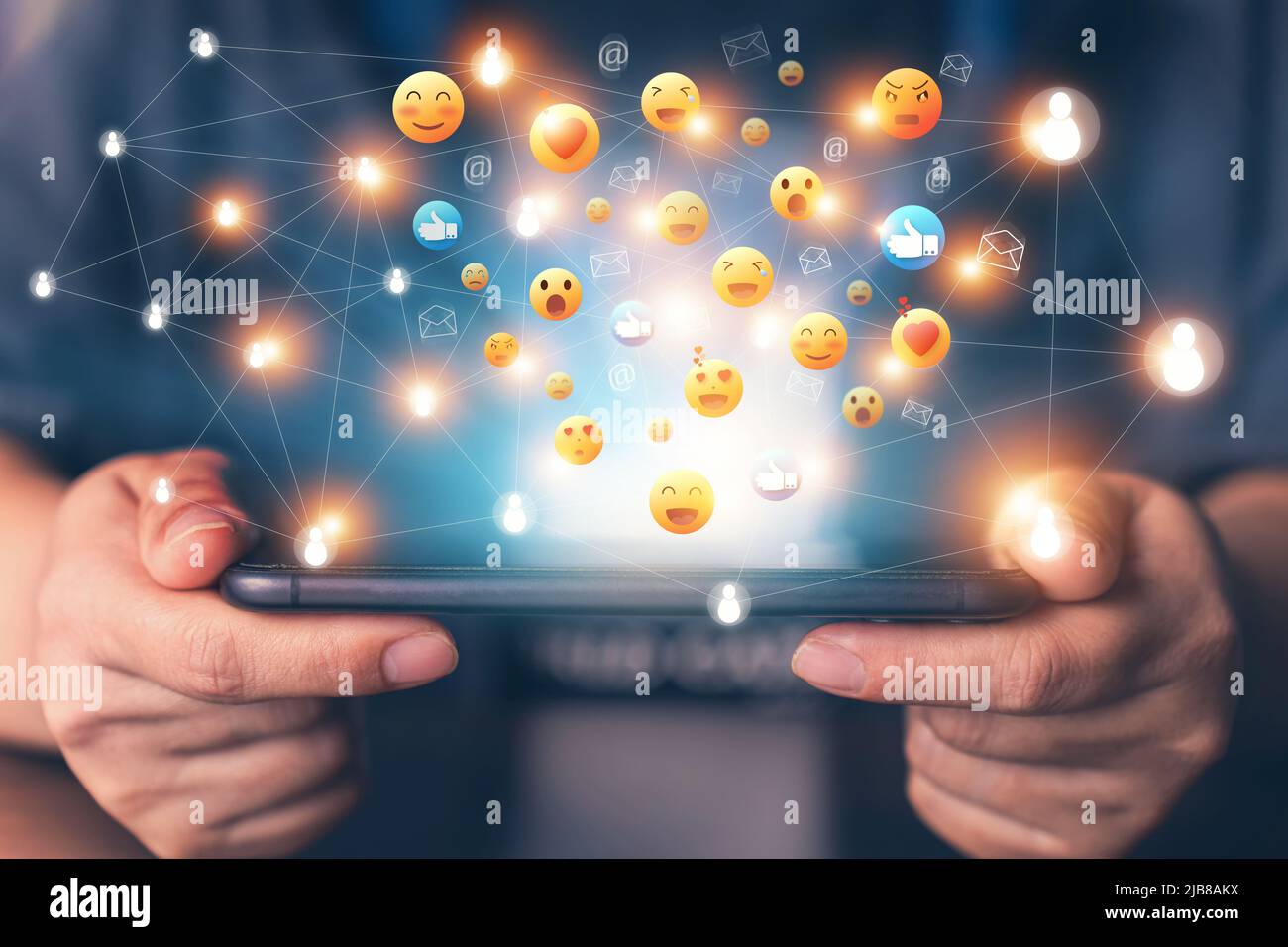 Hands holding and typing to communicate with others through emoji ...