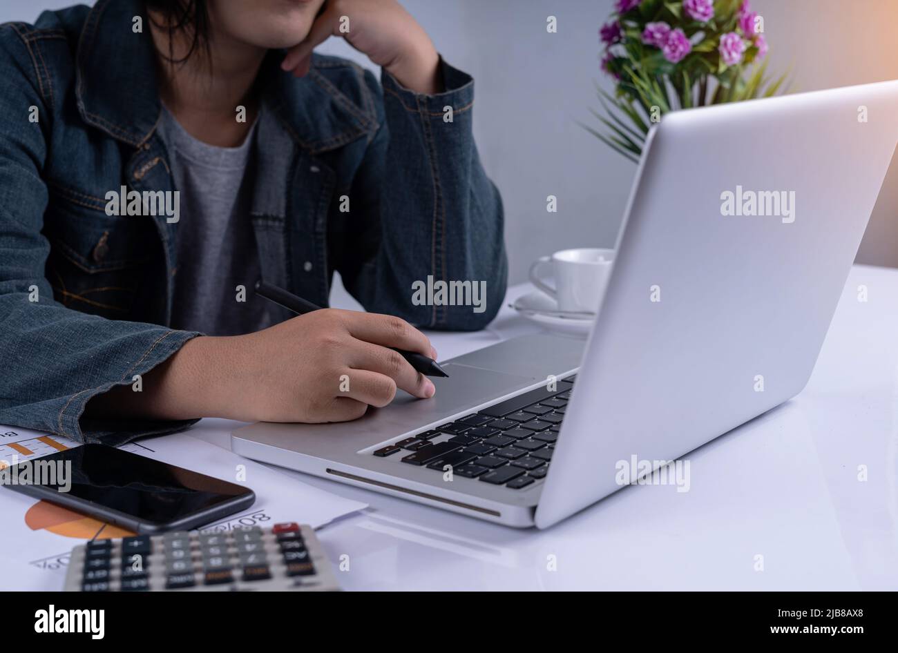 Business woman working and watching the computer bored. Woman typing on ...