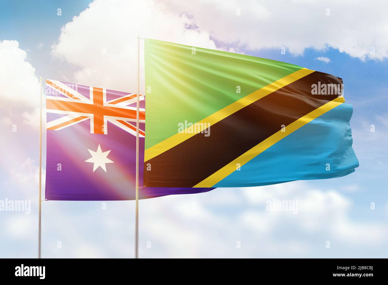 Sunny blue sky and flags of tanzania and australia Stock Photo - Alamy