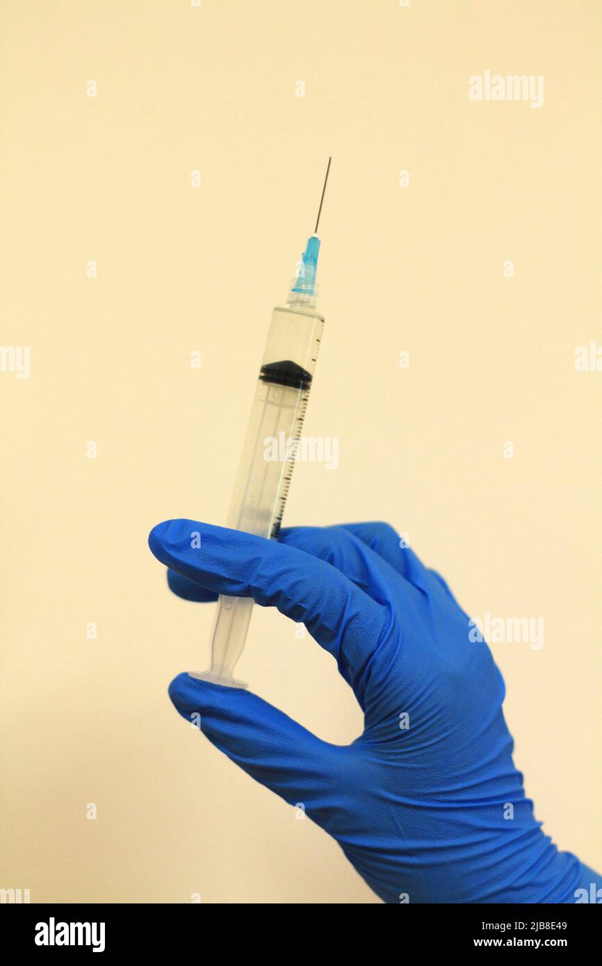 vaccine injection pushing Stock Photo - Alamy