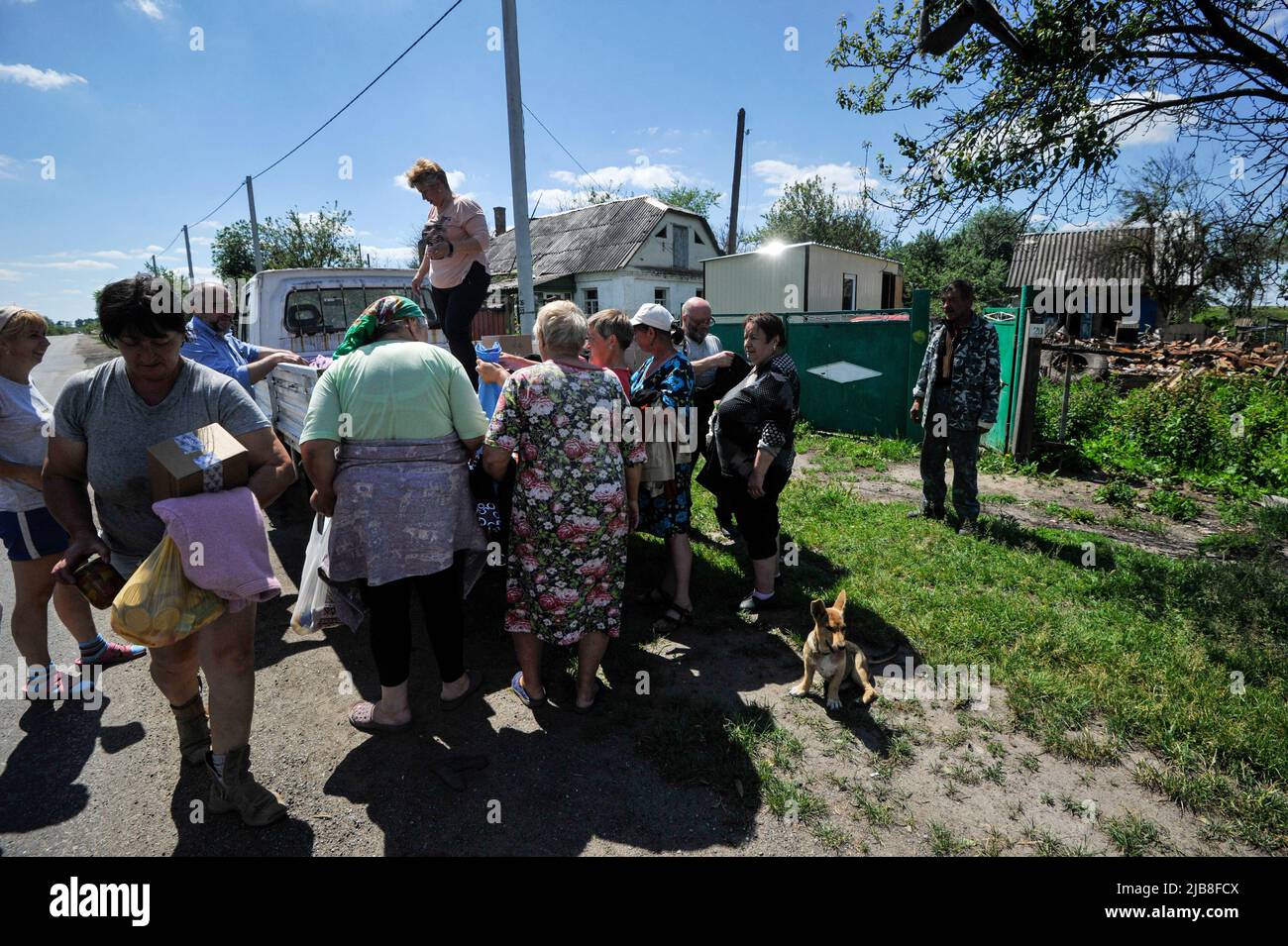 People receive humanitarian aid in the village of Andriivka in Kyiv ...