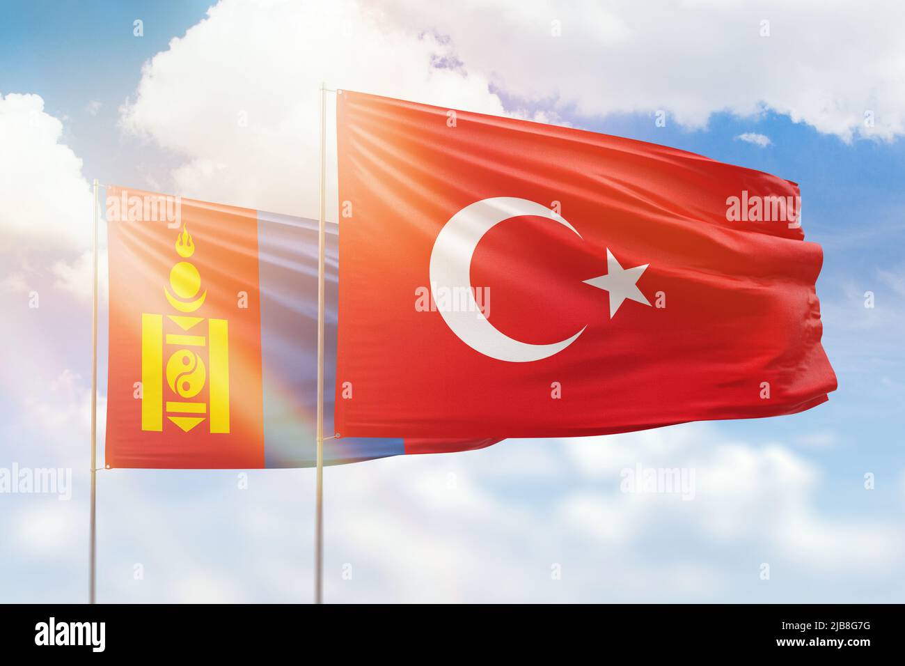 Sunny blue sky and flags of turkey and mongolia Stock Photo - Alamy