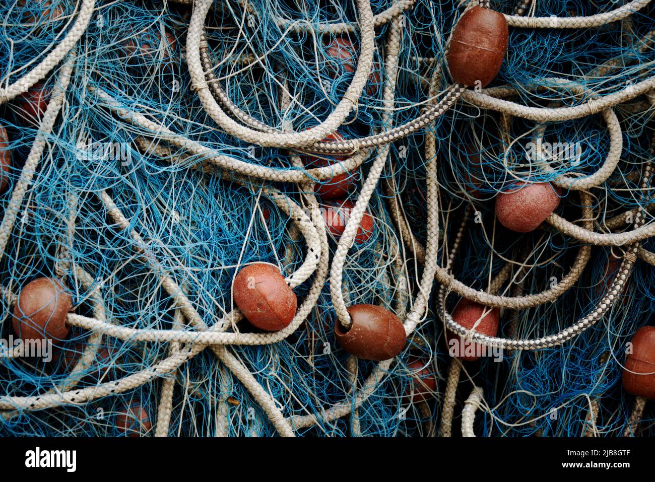 Close-up of blue colored fishing net - fishing net from a fisherman ...