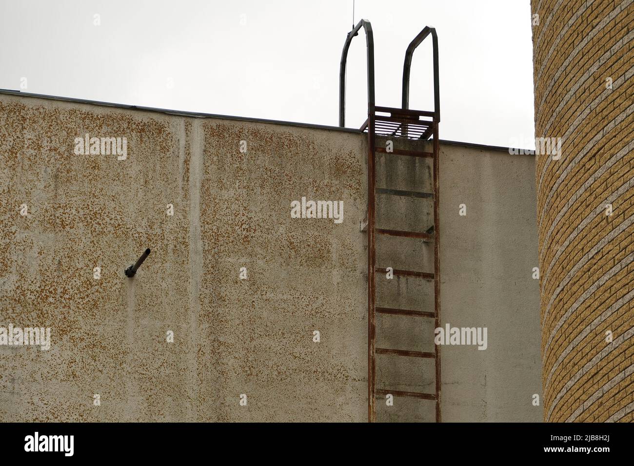 Vertical fire escape on the building. Fire safety Stock Photo - Alamy
