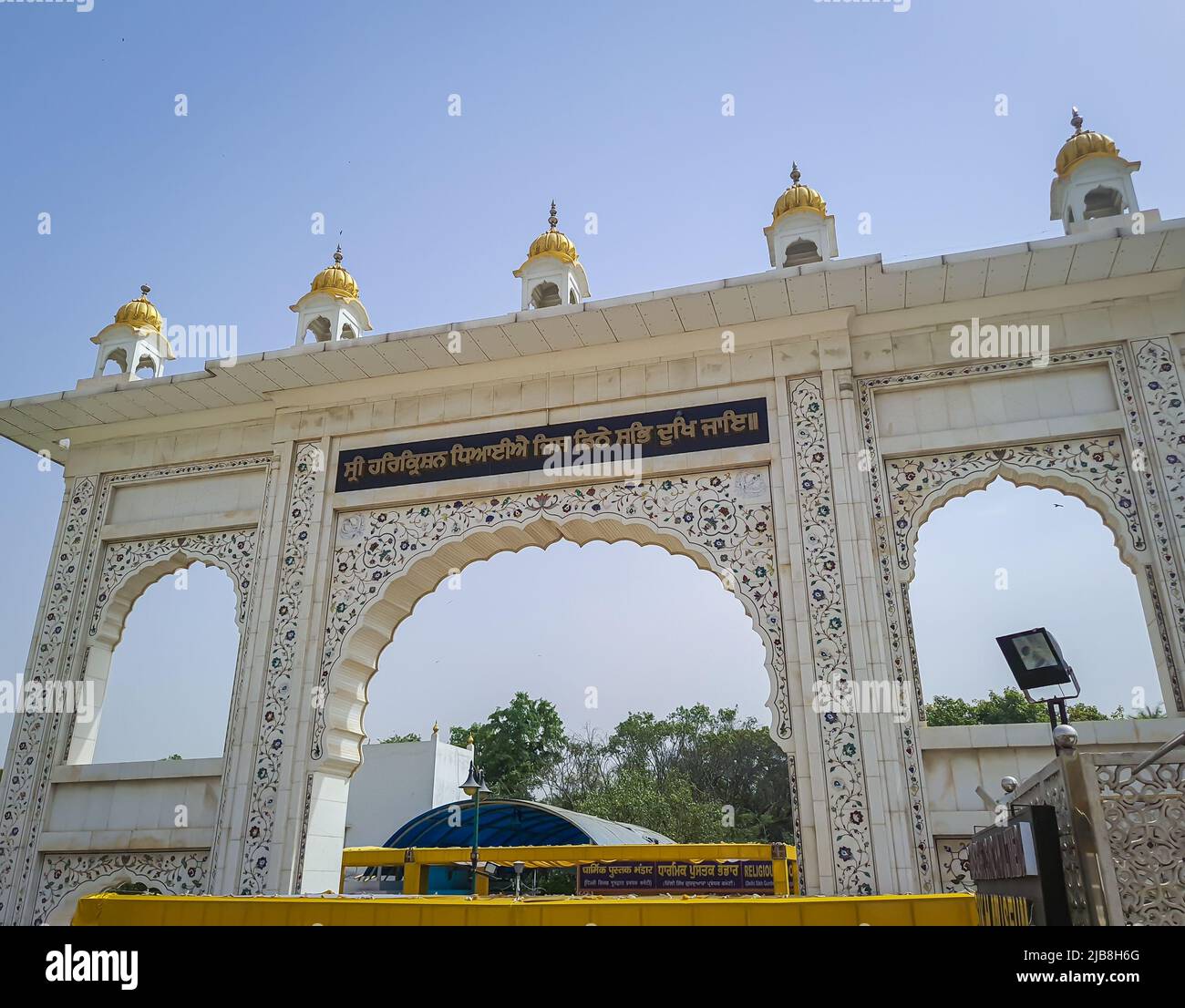 isolated gurudwara building entrance gate with flat sky at morning from ...