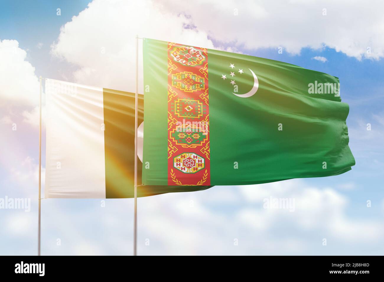 Sunny blue sky and flags of turkmenistan and pakistan Stock Photo - Alamy