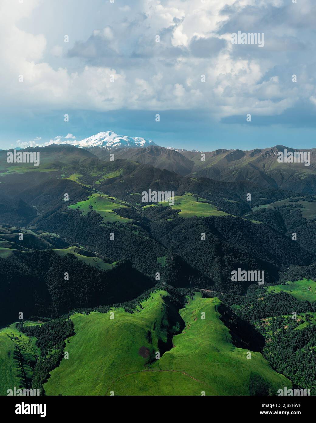 A river flowing through a mountain valley dividing it into two parts ...