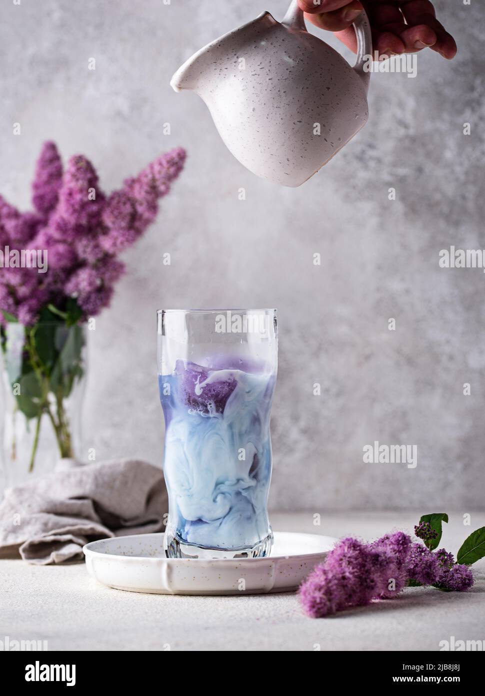 Butterfly pea blue tea with milk Stock Photo - Alamy