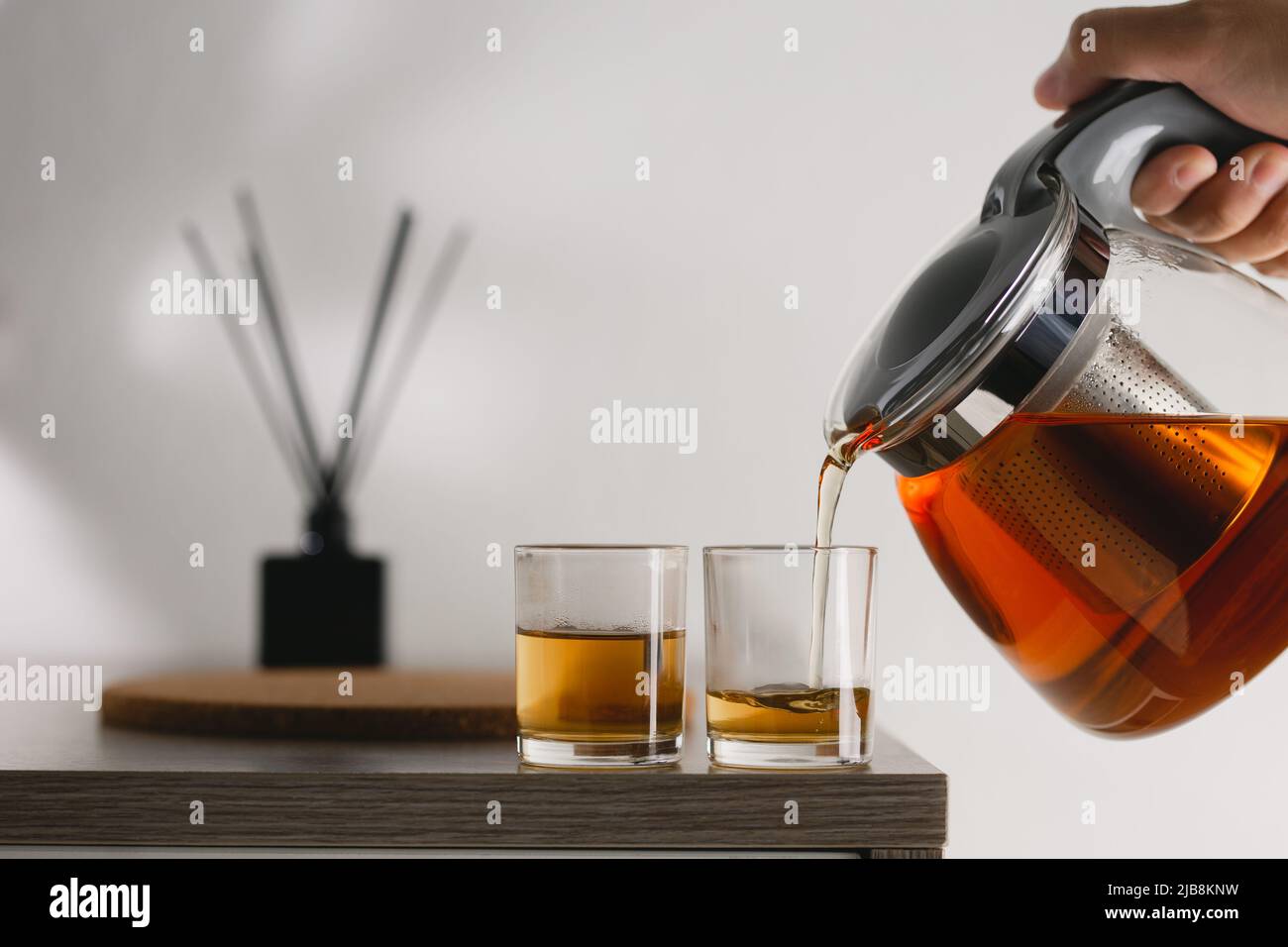 Tea being poured into a tea cup hi-res stock photography and images - Alamy