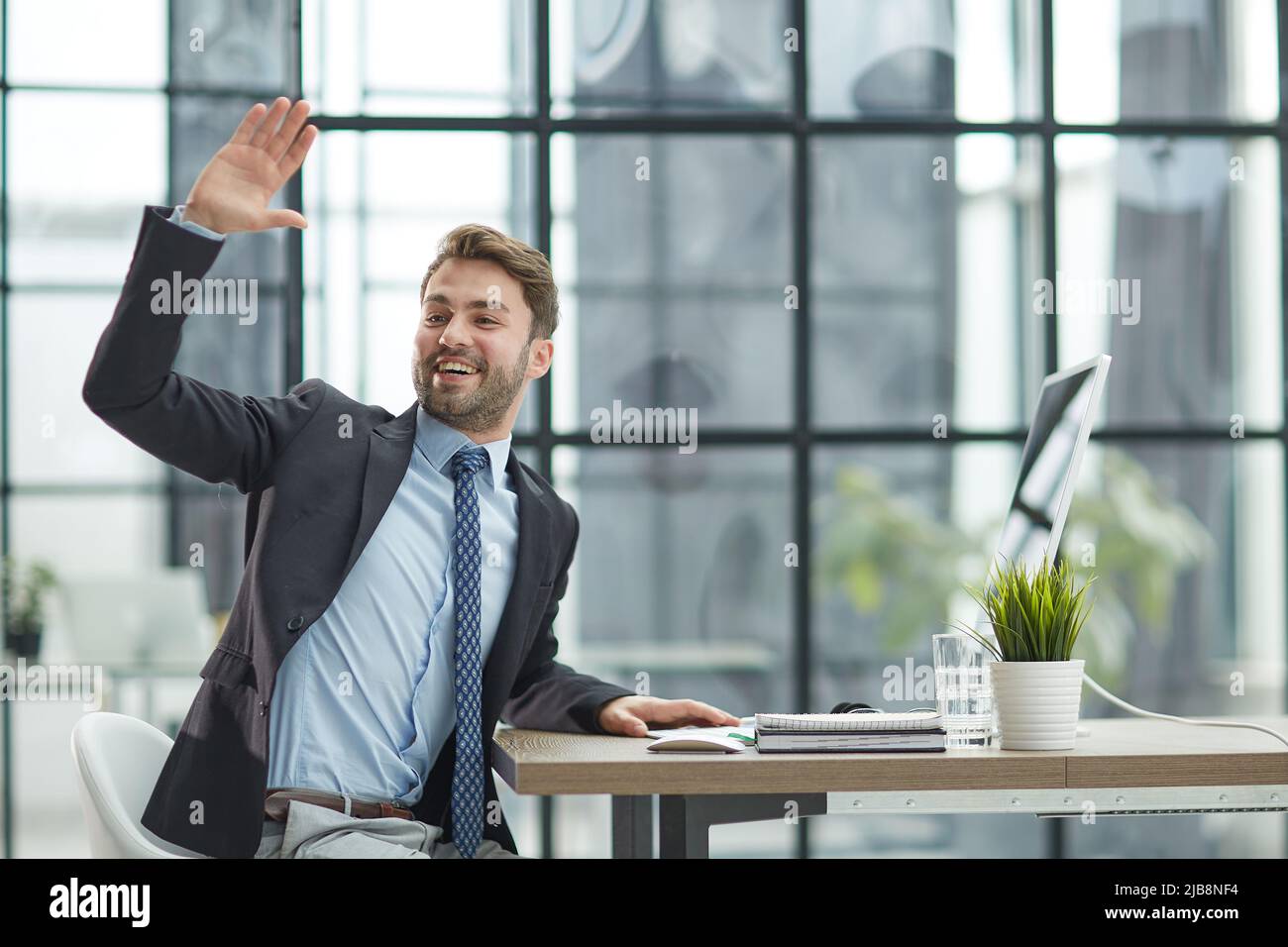 Hello by Man in Office, Indoor Waving Hand Stock Photo - Alamy