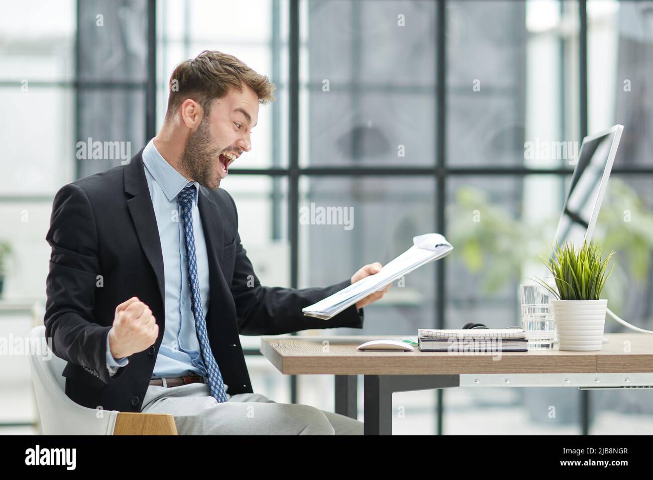 funny male employee have fun perform winner in modern office Stock ...