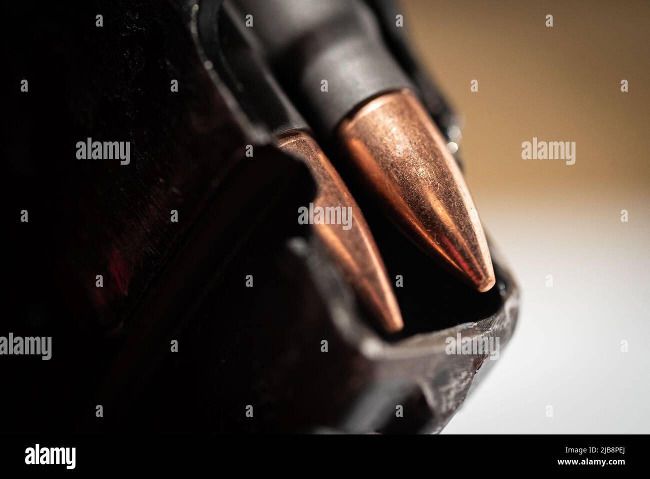 An AK-47 style assault rifle 30-round magazine is loaded with 7.62 x 39 ...