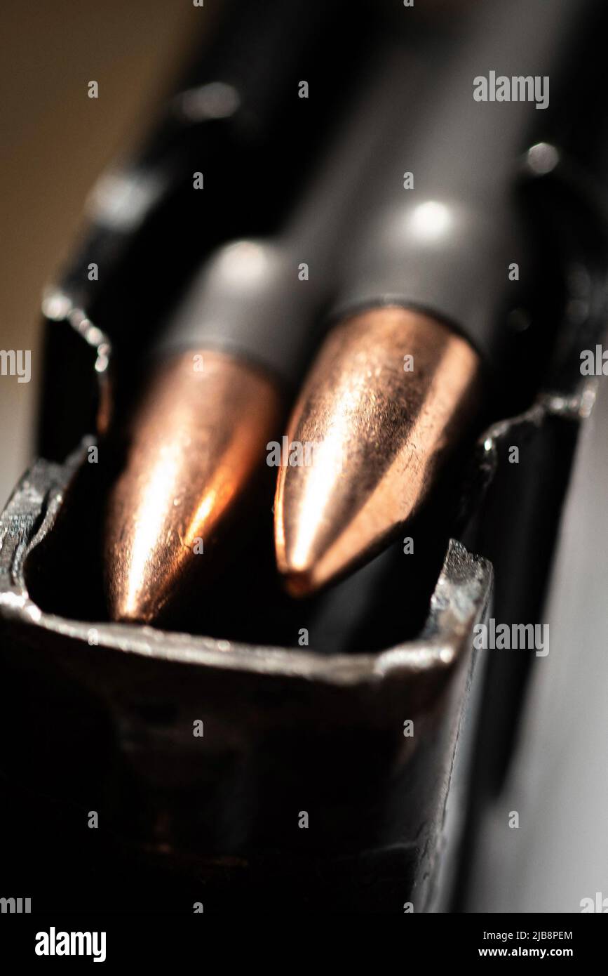 An AK-47 style assault rifle 30-round magazine is loaded with 7.62 x 39 ...