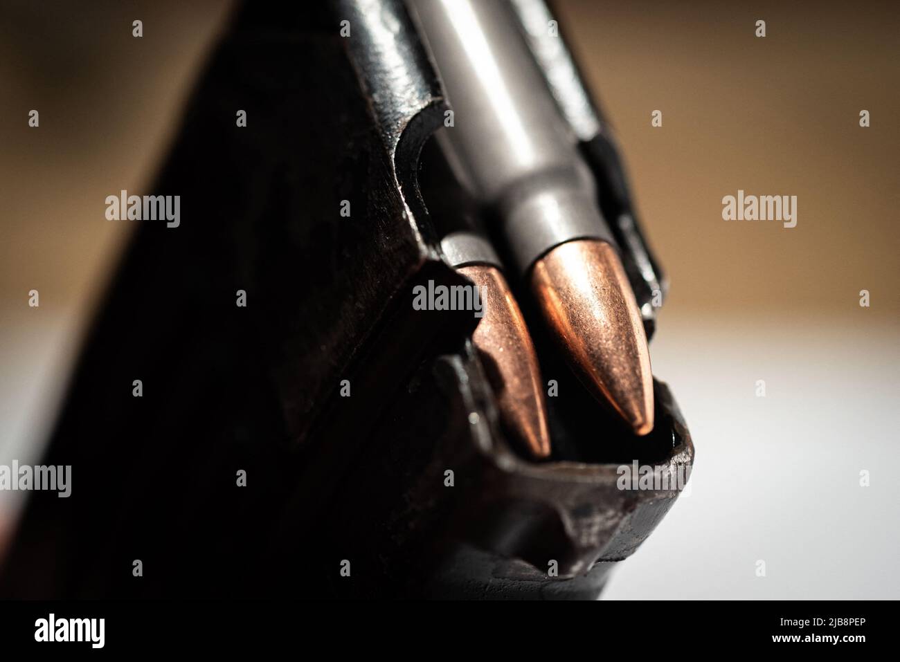 An AK-47 style assault rifle 30-round magazine is loaded with 7.62 x 39 ...