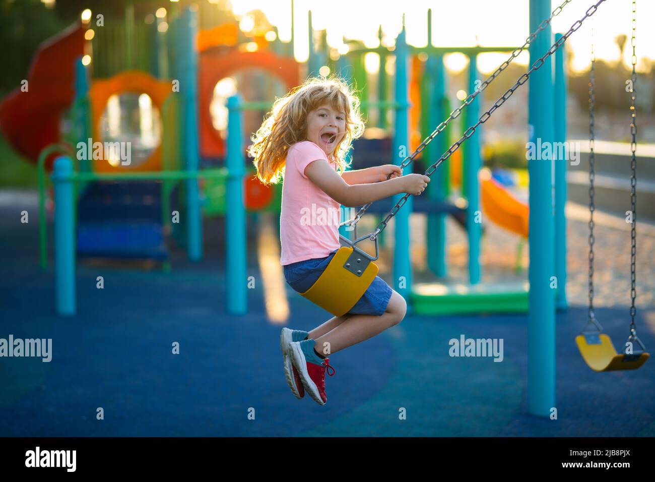 Little Kids Playing On The Playground